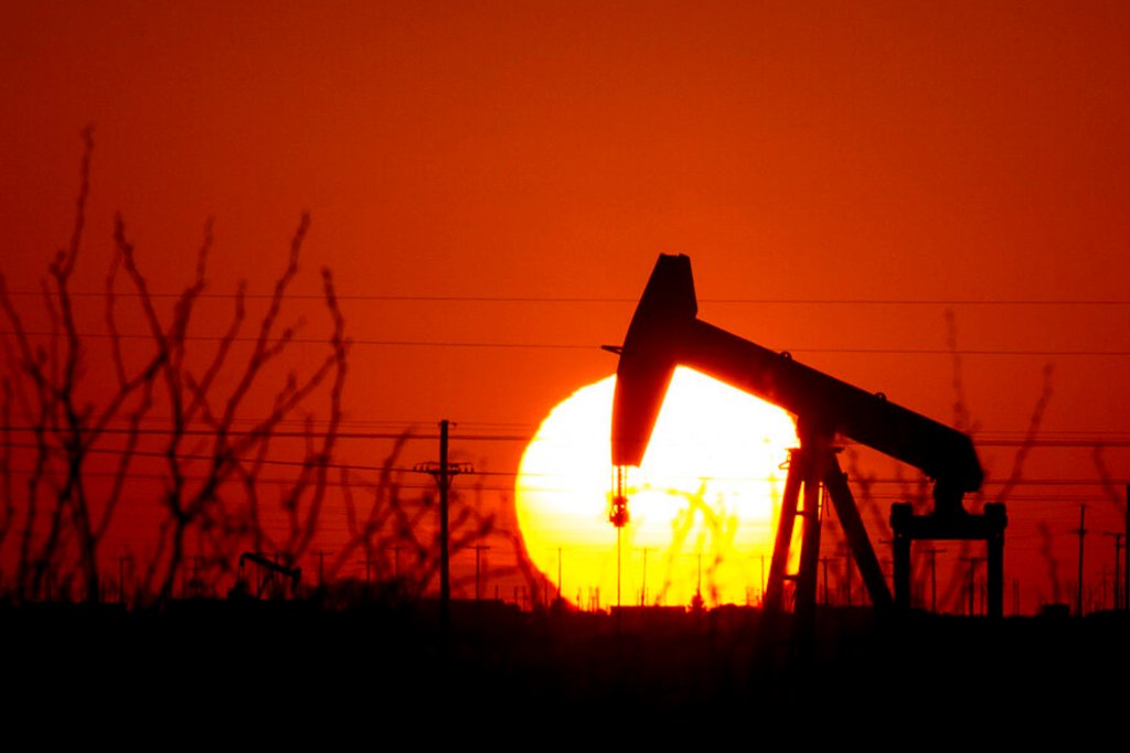 Oil tumbles below $100 a barrel, down 25% from peak