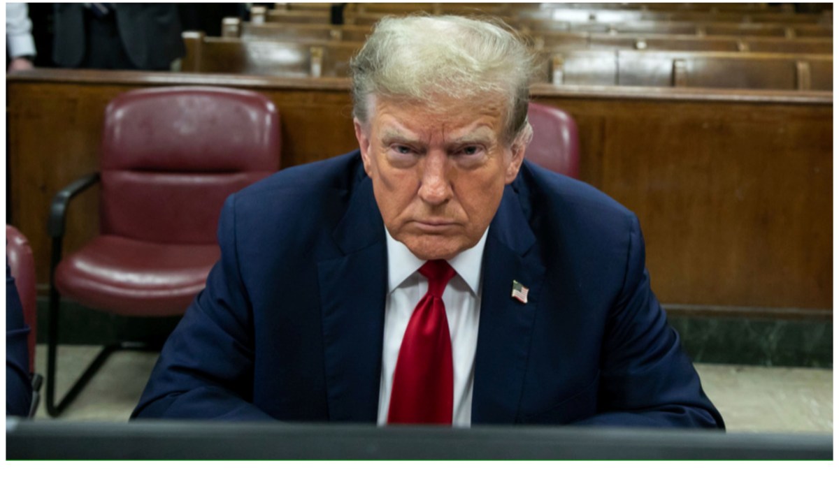 Trump decries 'persecution' as he walks into historic trial