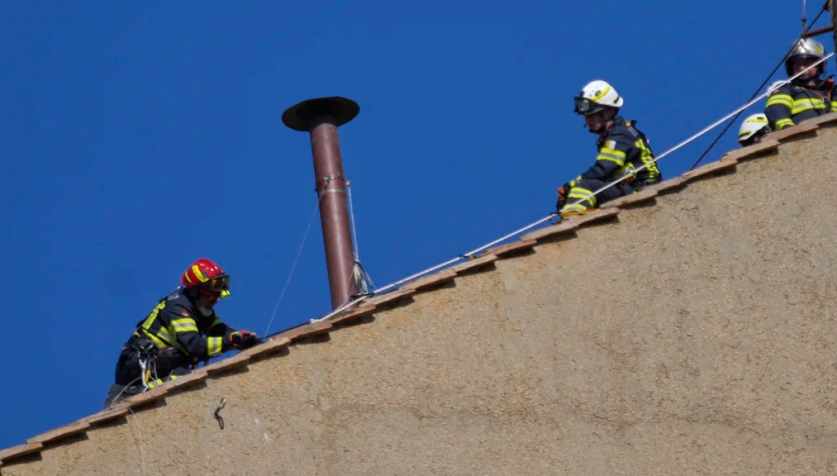 Sistine Chapel chimney installed by Vatican fire corps ahead of conclave